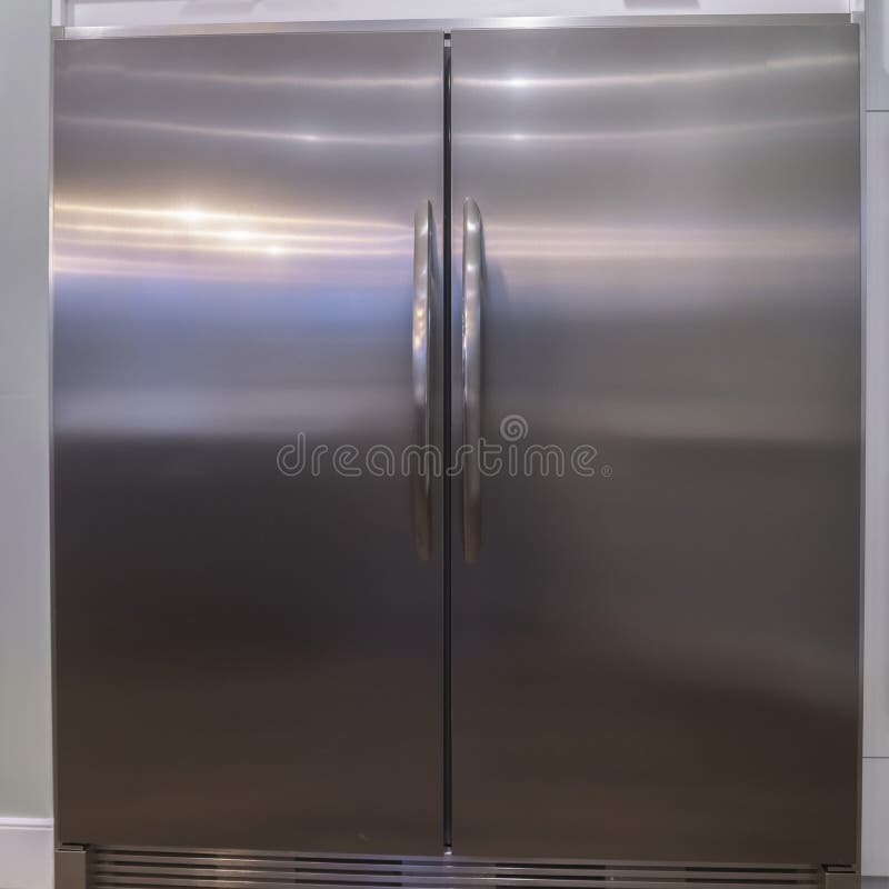 Large Double Door Fridge with Fitted Ovens Stock Image - Image of ...