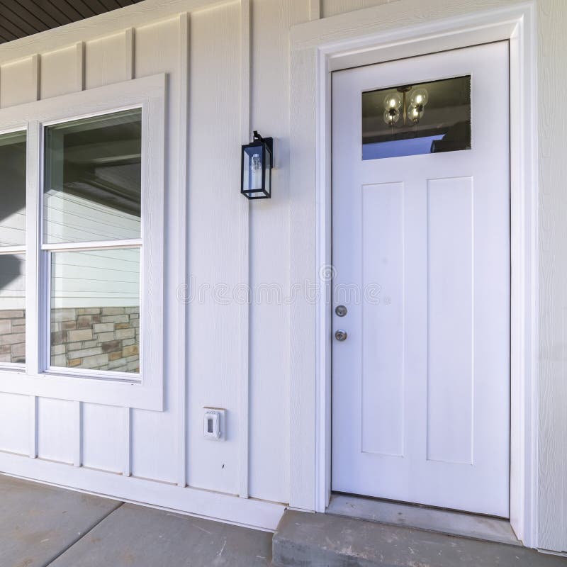 Square Frame Large Square Window Alongside a White Door Stock Photo ...