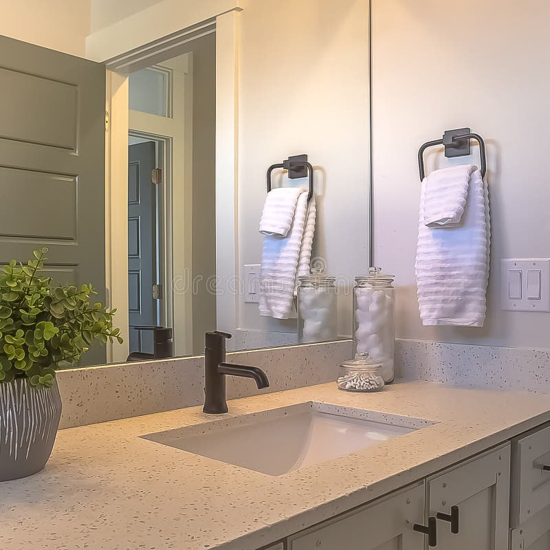 Square Frame Mirror and Vanity Unit Inside a Bathroom with White Wall ...
