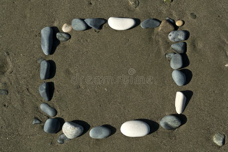 Stone frame on beach sand stock photo. Image of square - 210406300