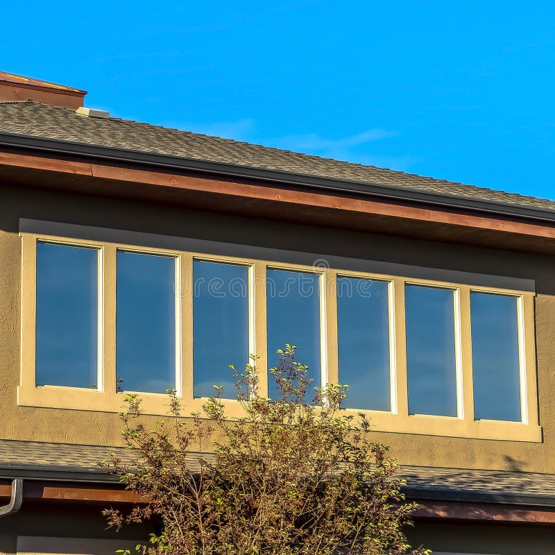 Square Frame Upper Storey of a House Lined with Rectangular Windows ...
