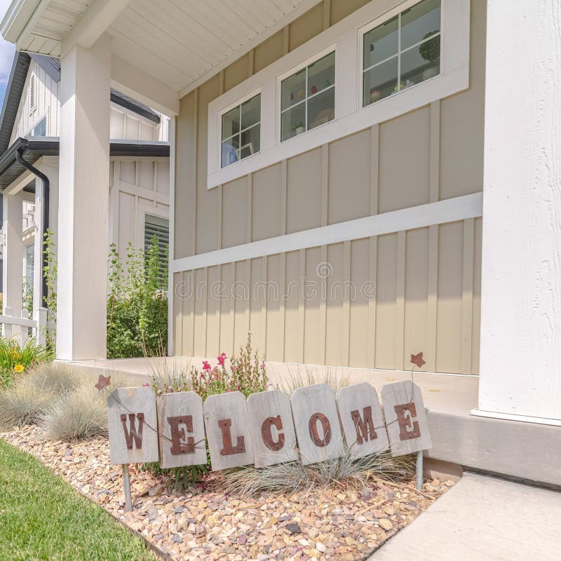 Square Frame Welcome Sign in Front Garden of Traditional Home Stock ...