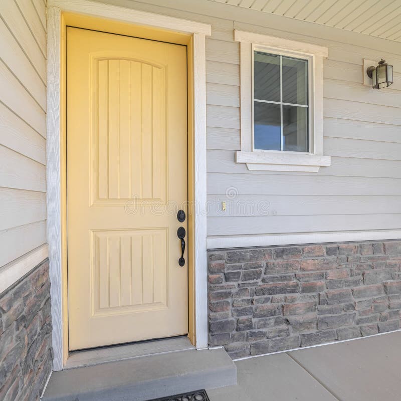 Square Front Veranda of Suburban Home with a Yellow Door Stock Image ...
