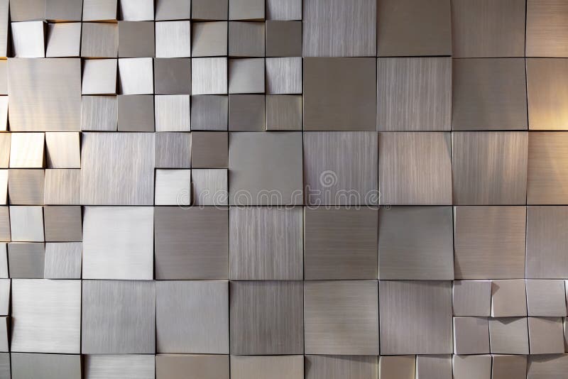 Square Gold Tiles of Different Sizes on the Wall. Rough Surface Texture ...