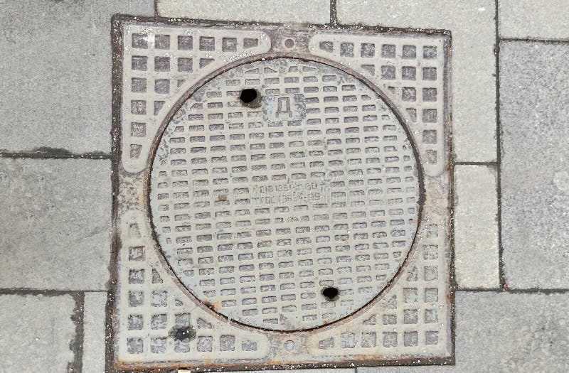 A Square Hatch on the Sidewalk. Stock Photo - Image of square, paving ...