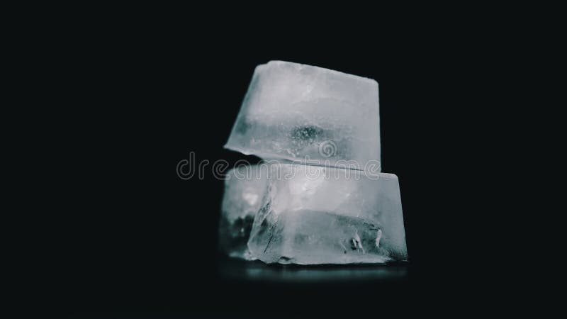Square Ice Cubes are Spinning on a Black Background Stock Footage ...