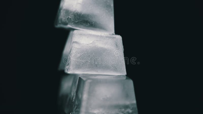 Square Ice Cubes are Spinning on a Black Background Stock Video - Video ...