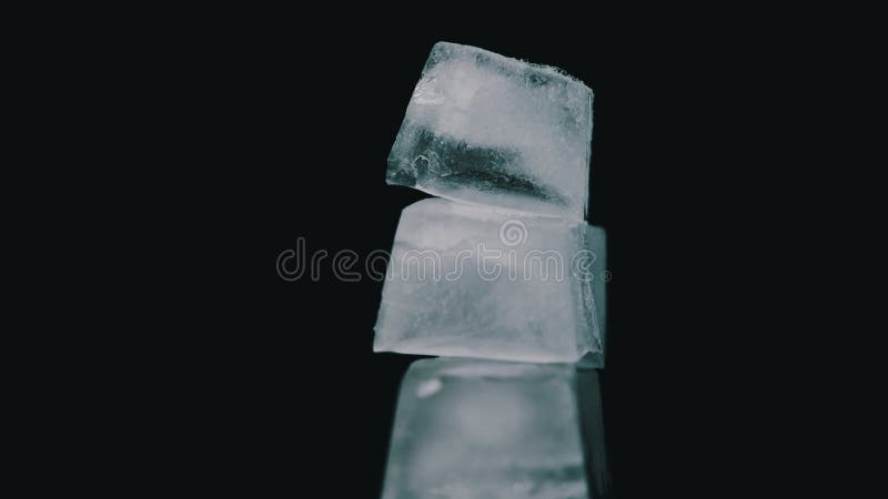 Square Ice Cubes are Spinning on a Black Background Stock Video - Video ...