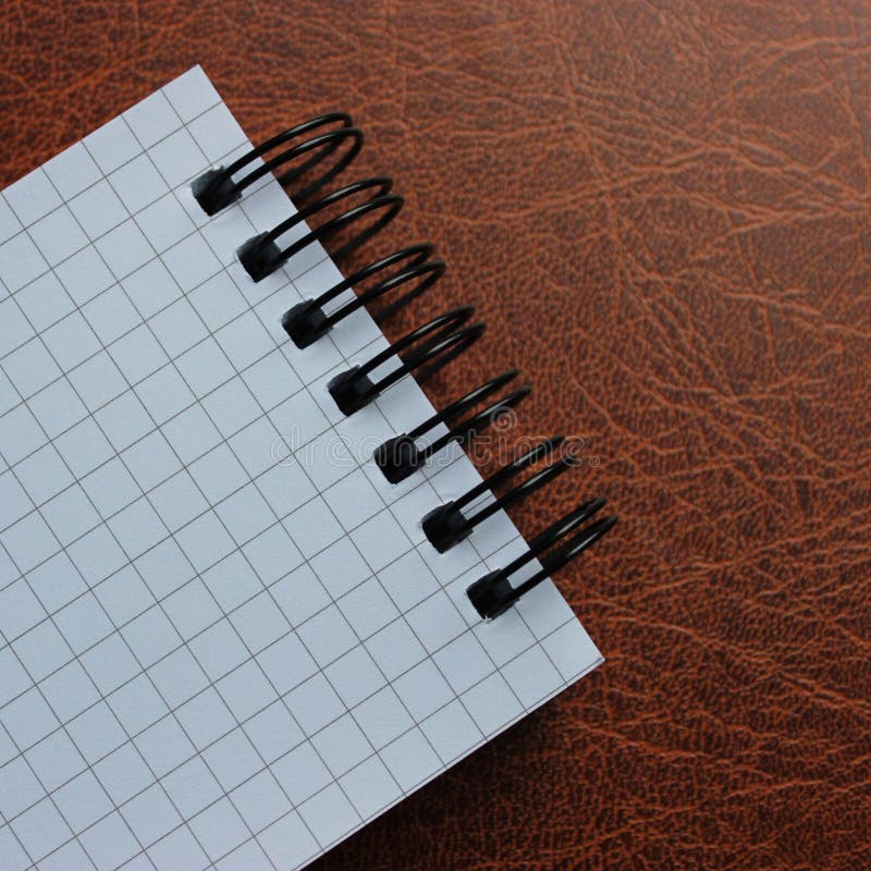 Square Image of Bound Notepad with White Page on Leather Surface Stock ...