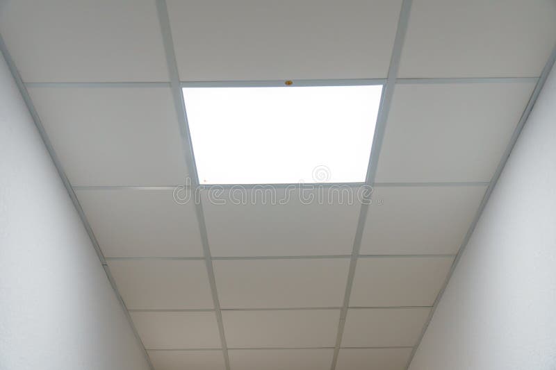 Square Fluorescent Lamps on the Ceiling. Thick Pipes of the Air ...