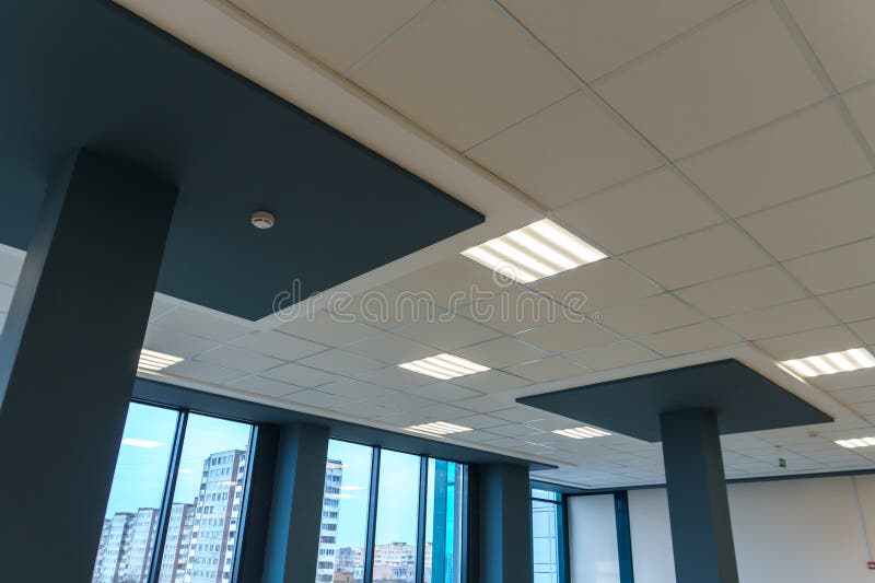 Square Fluorescent Lamps on the Ceiling. Thick Pipes of the Air ...