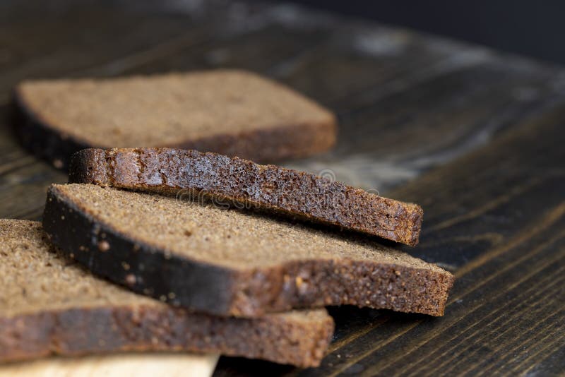Square Loaf of Black Rye Bread Cut into Pieces Stock Photo - Image of ...