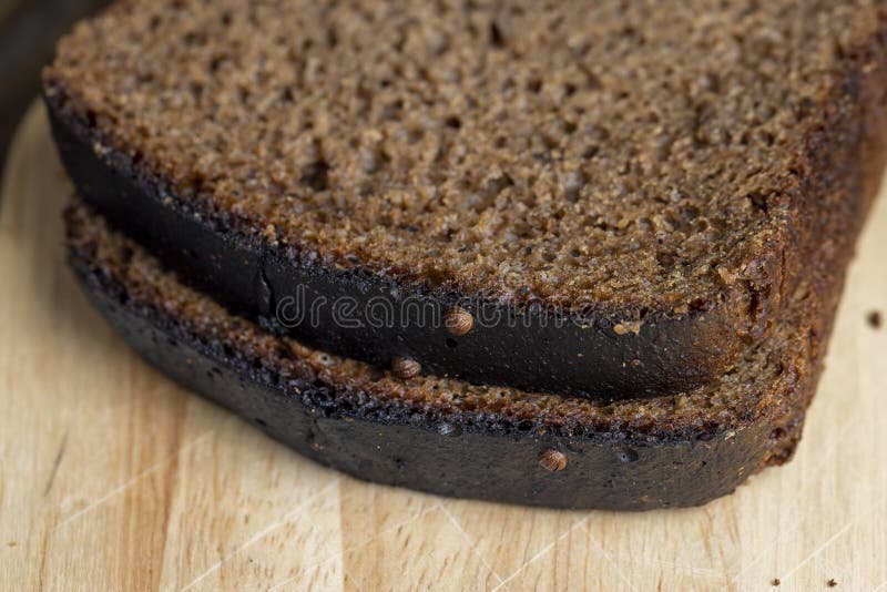 Square Loaf of Black Rye Bread Cut into Pieces Stock Photo - Image of food, fresh: 333688824