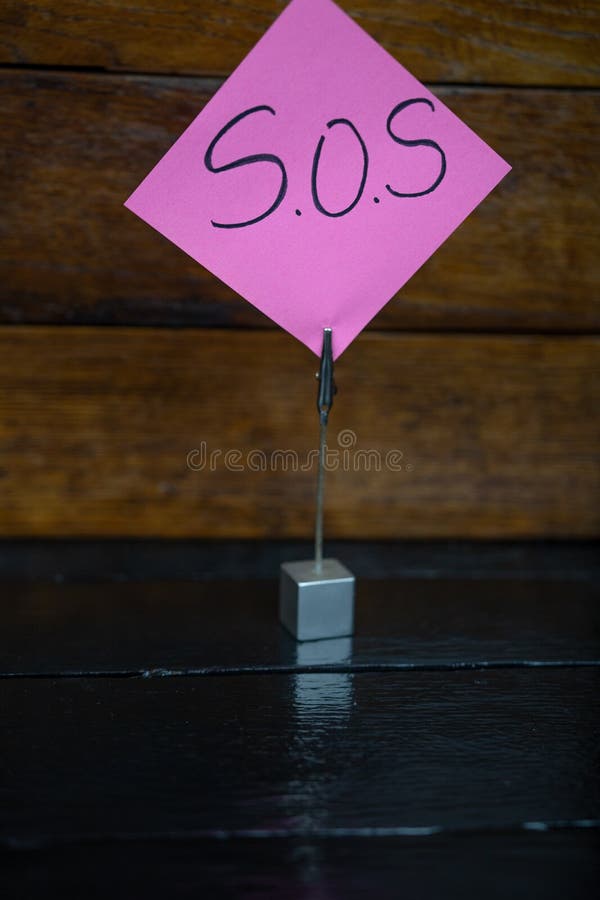 Square Memo Holder with Memo Post Reminder. Writing SOS on Paper Stock ...