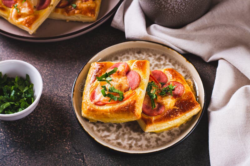 Square Mini Pie Baked with Tomato, Sausage and Cheese on a Plate for a ...
