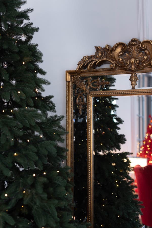 A Square Mirror with a Vintage Frame Near a Christmas Tree Stock Image ...