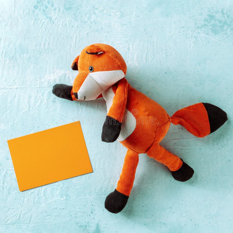 Square Mockup for an Orange Card with a Toy Fox. a Greeting Card or ...