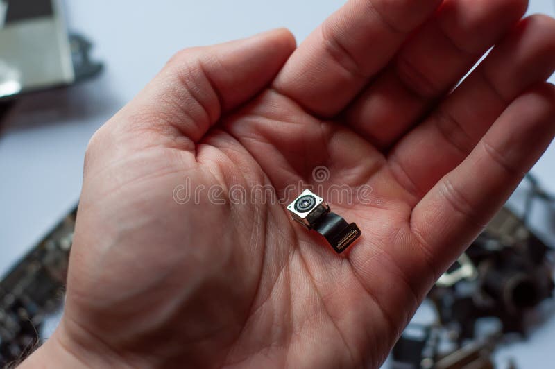 Square Module of a Small Camera with a Loop for Connection in the Palm ...