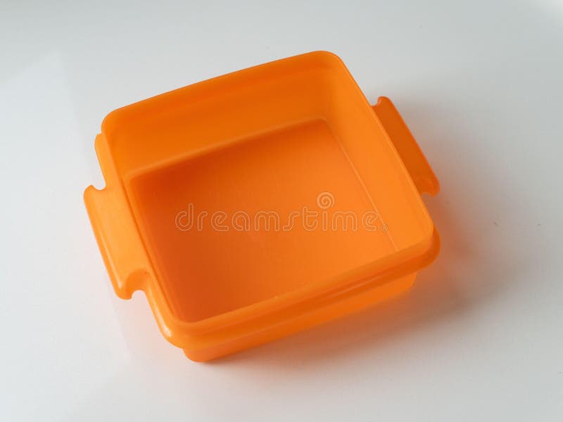 Orange Plastic Pote Over White Table Stock Image - Image of food, edges ...