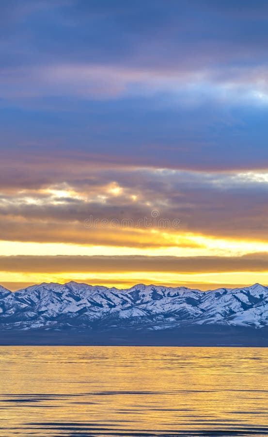 Square Panoramic View of a Shiny Lake and Mountain Covered with Sharp ...