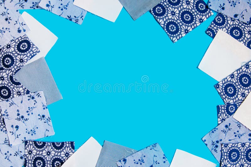 Square Patches of Blue Printed Fabric on a Blue Background. Space for ...