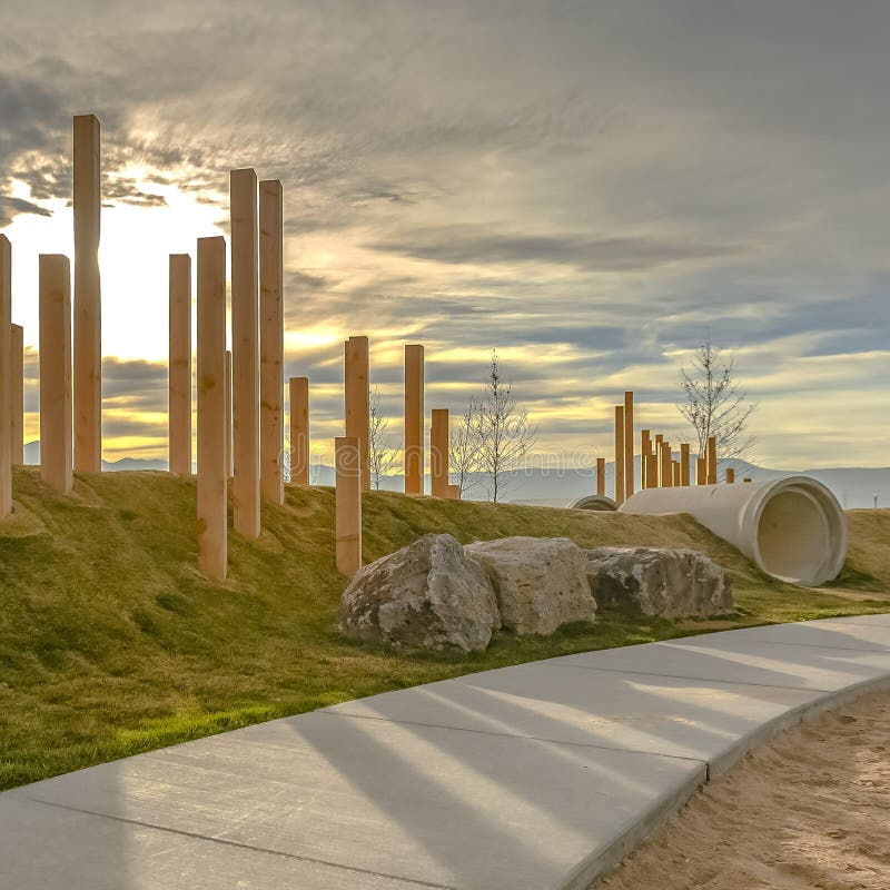 Square Paved Pathway Running through a Sandy and Grassy Terrain on a ...