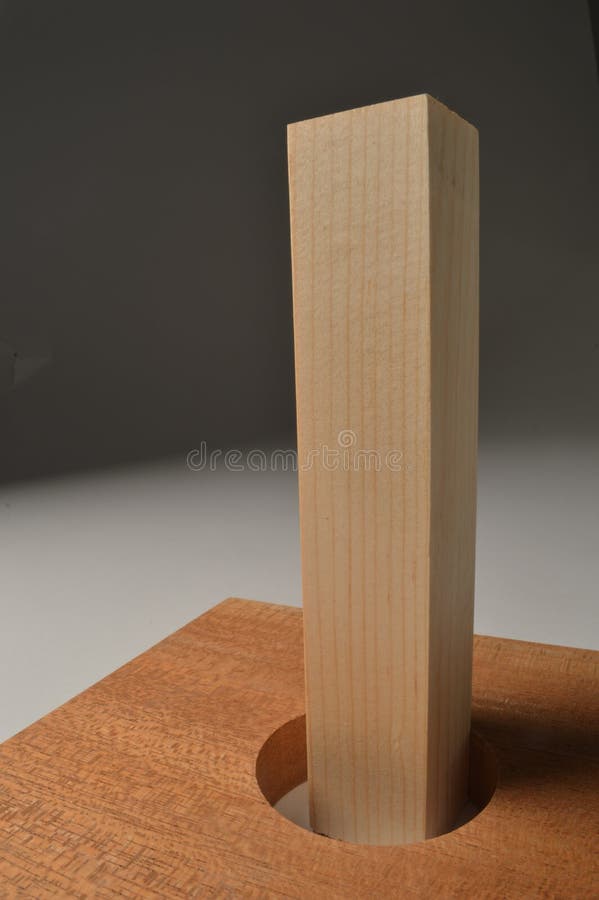 Square peg in a round hole stock image. Image of square - 245564287