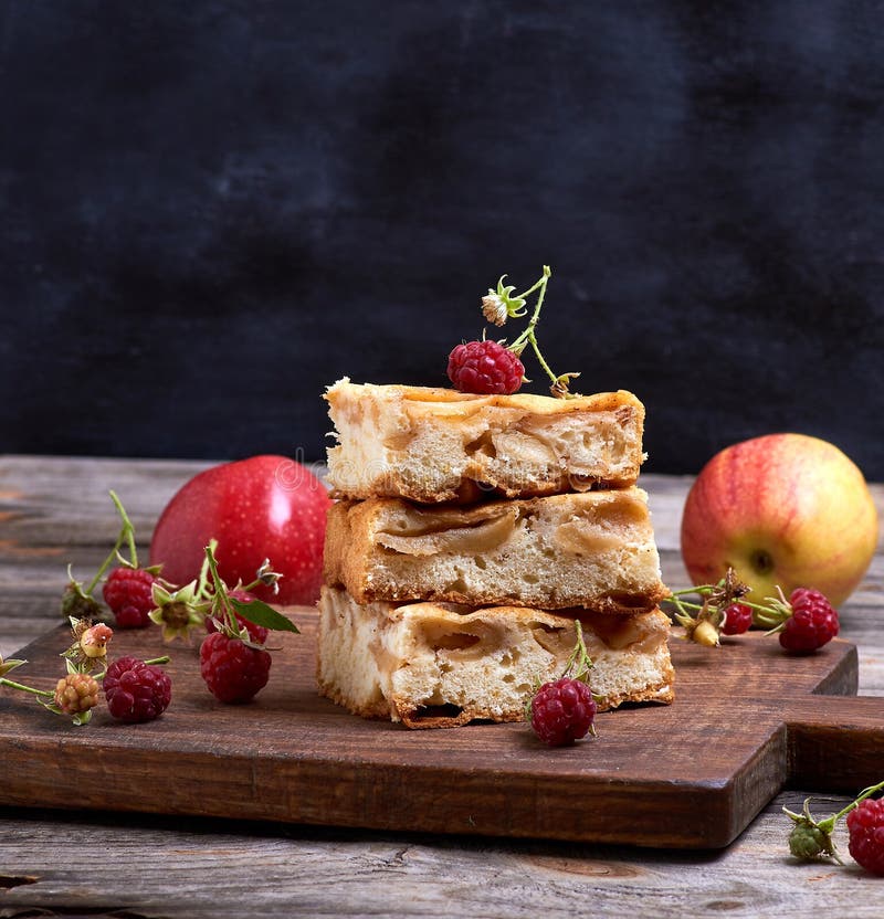 Square Pieces of Apple Pie are Stacked on a Brown Wooden Board Stock ...