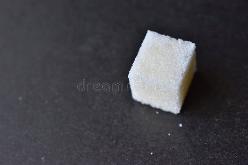 Square Pieces of Refined Sugar on a Black Background Stock Photo ...