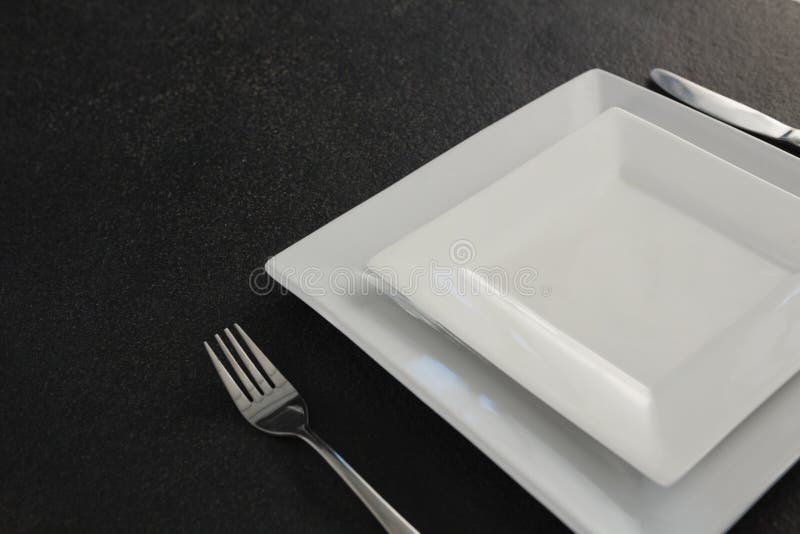 Square Plates and Cutlery Set on a Table Stock Image - Image of party ...