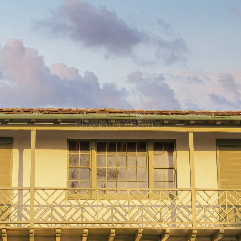 Square Puffy Clouds at Sunset Low Angle View of a Balcony with Two ...