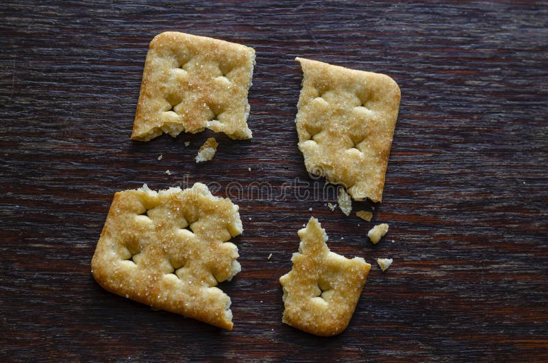 Square Saltine Cracker is Broken into Four Random Pieces Stock Image ...