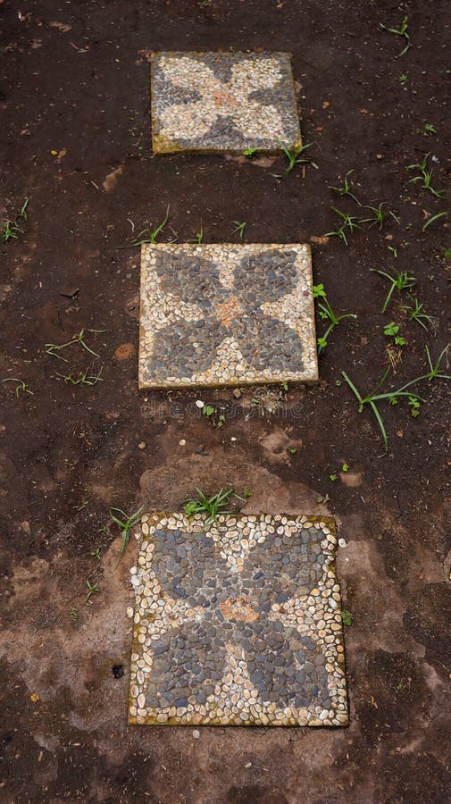 A Pathway Square Shape Stepping Stone Laying on the Groud at Garden or ...