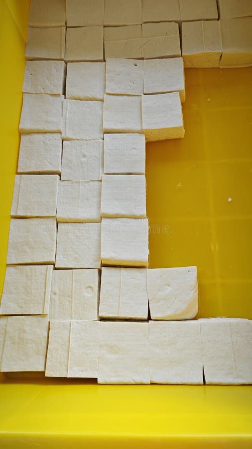 Square-shaped Soft Solid White Tofu Blocks in the Yellow Plastic Tray ...