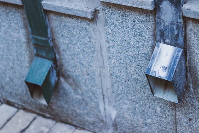 Square Shaped Tin Gutters Against a Gray Stone Wall Stock Image - Image ...