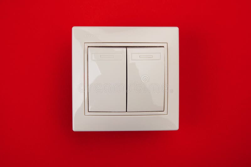 A Square Shaped White Plastic Light Switch Isolated on Red Stock Photo ...