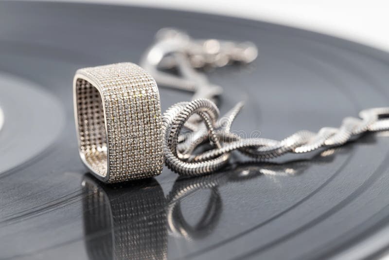 Square Silver Diamond Ring and Silver Snake Chain Stock Image - Image ...