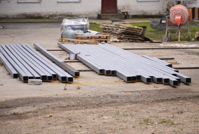 Square Steel Pipes. Metal Products Lie Outdoors on a Construction Site ...