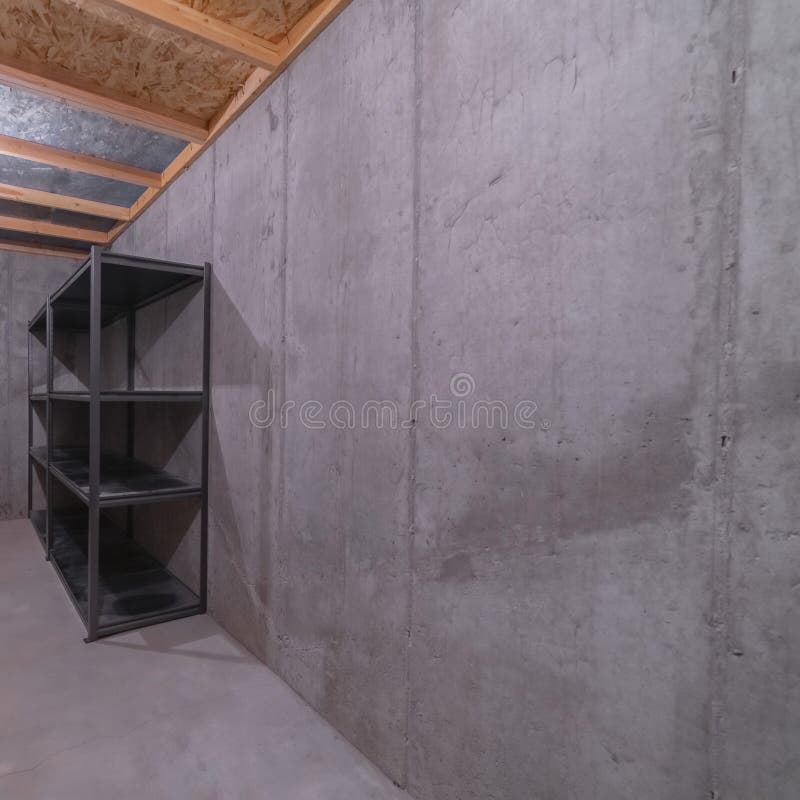 Square Storage Shelves in a Bare Concrete Room Stock Photo - Image of ...
