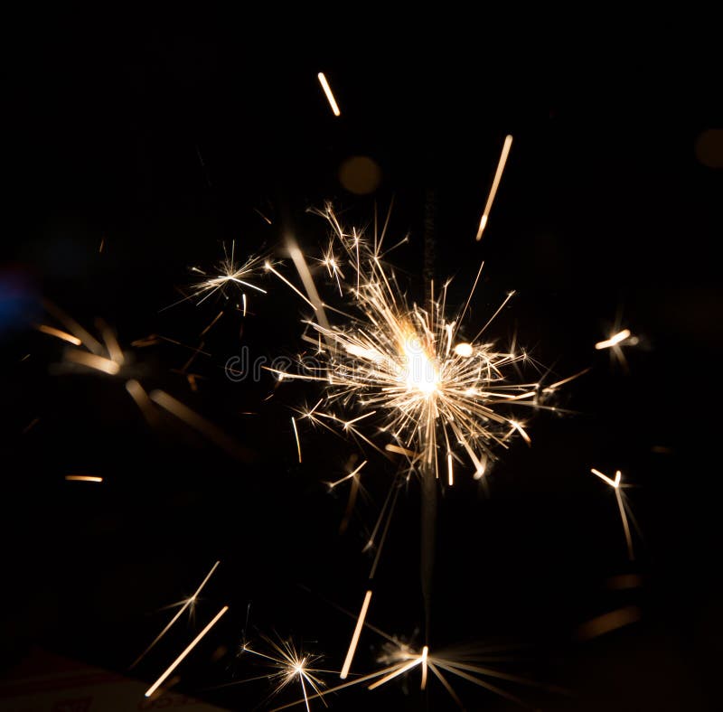 Bengal Fire On A Black Background And Blurred Bokeh Blue Lights New ...