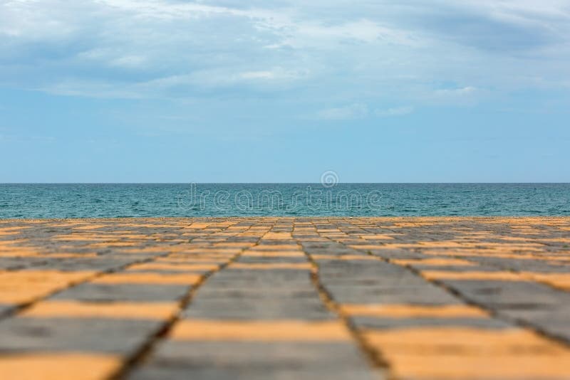 Square Tile Platform on the Background of the Sea Stock Photo - Image ...
