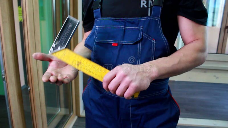 Square Tool in Hands of Professional Worker Man. Try Square Instrument ...