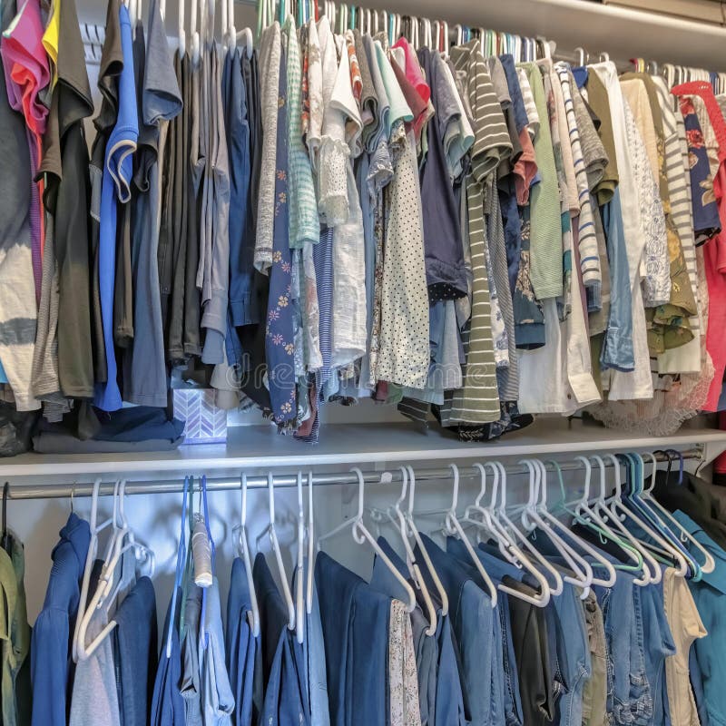 Square Walk in Closet Interior of a House with Open Shelving Unit Stock ...