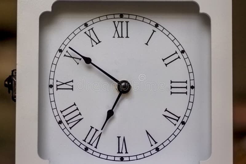 Square White Analog Clock Showing 5:46 with a Circular Face with Roman ...
