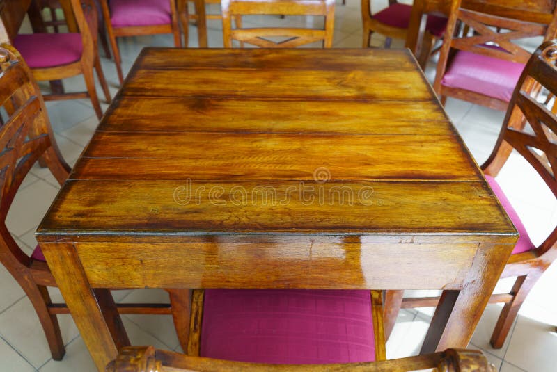 A Square Wooden Dining Table in a Restaurant Stock Photo - Image of ...