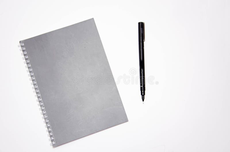 Squared Notebook with Black Pen on a White Background. Record Ideas ...