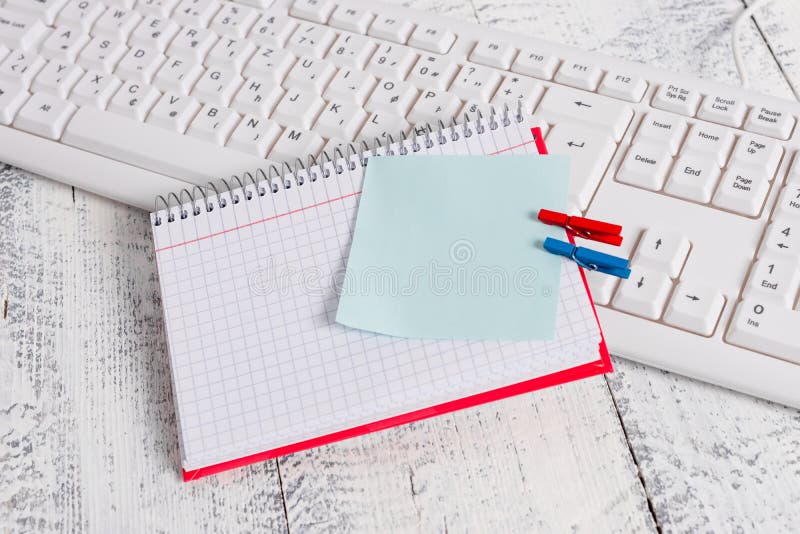 Squared Paper Notebook with a Rectangle Shaped Empty Note Above Pinned ...