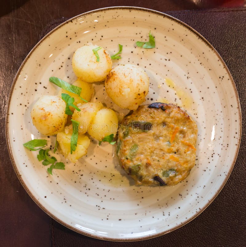 Squash Burger with Boiled Potatoes on a Plate. Top View Stock Photo ...
