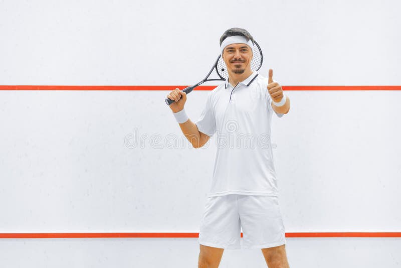 A Squash Player on a Squash Court with the Racket. White Sportswear ...