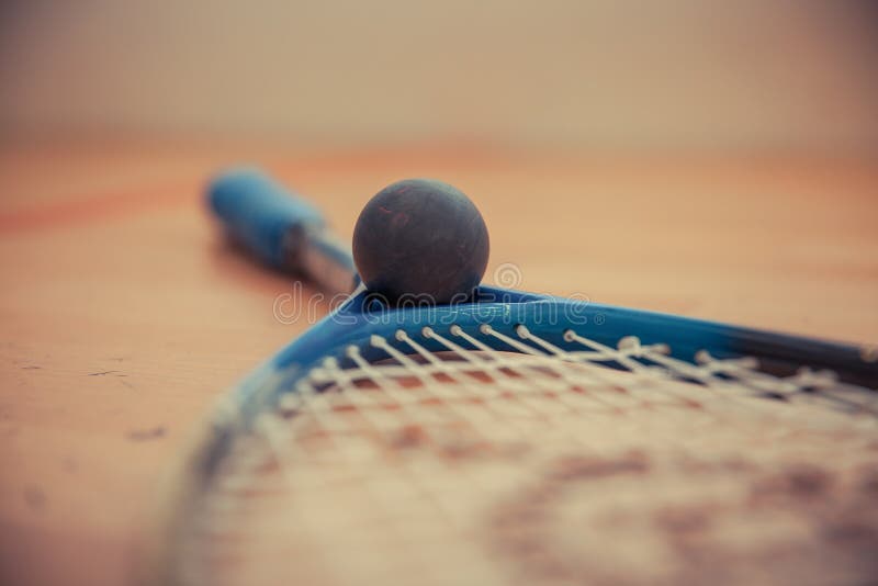 Squash Ball between Two Squash Rackets Stock Photo - Image of flooring ...